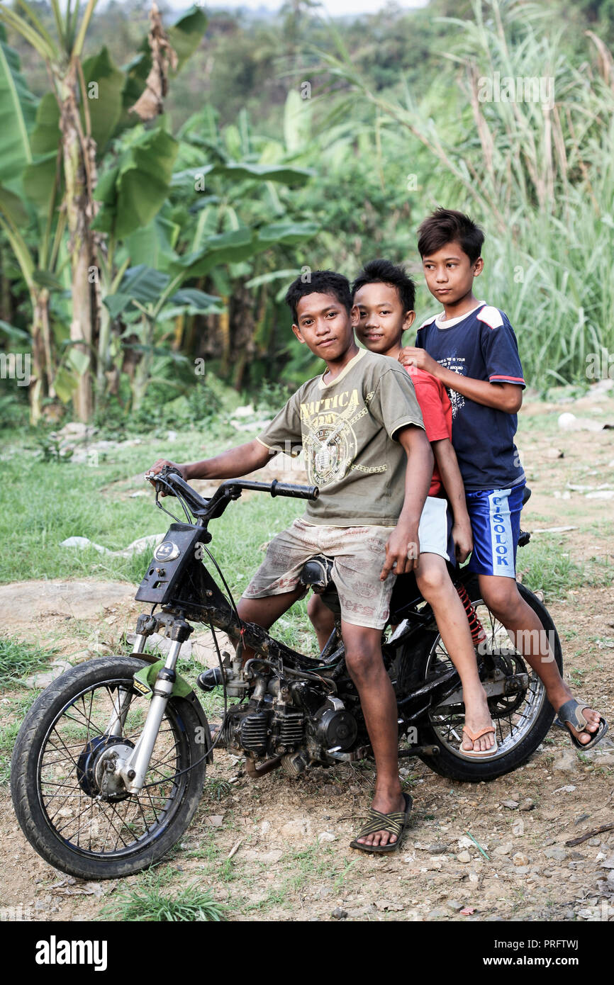 Indonesian boys on their motorbike in West Java, Indonesia Stock Photo ...