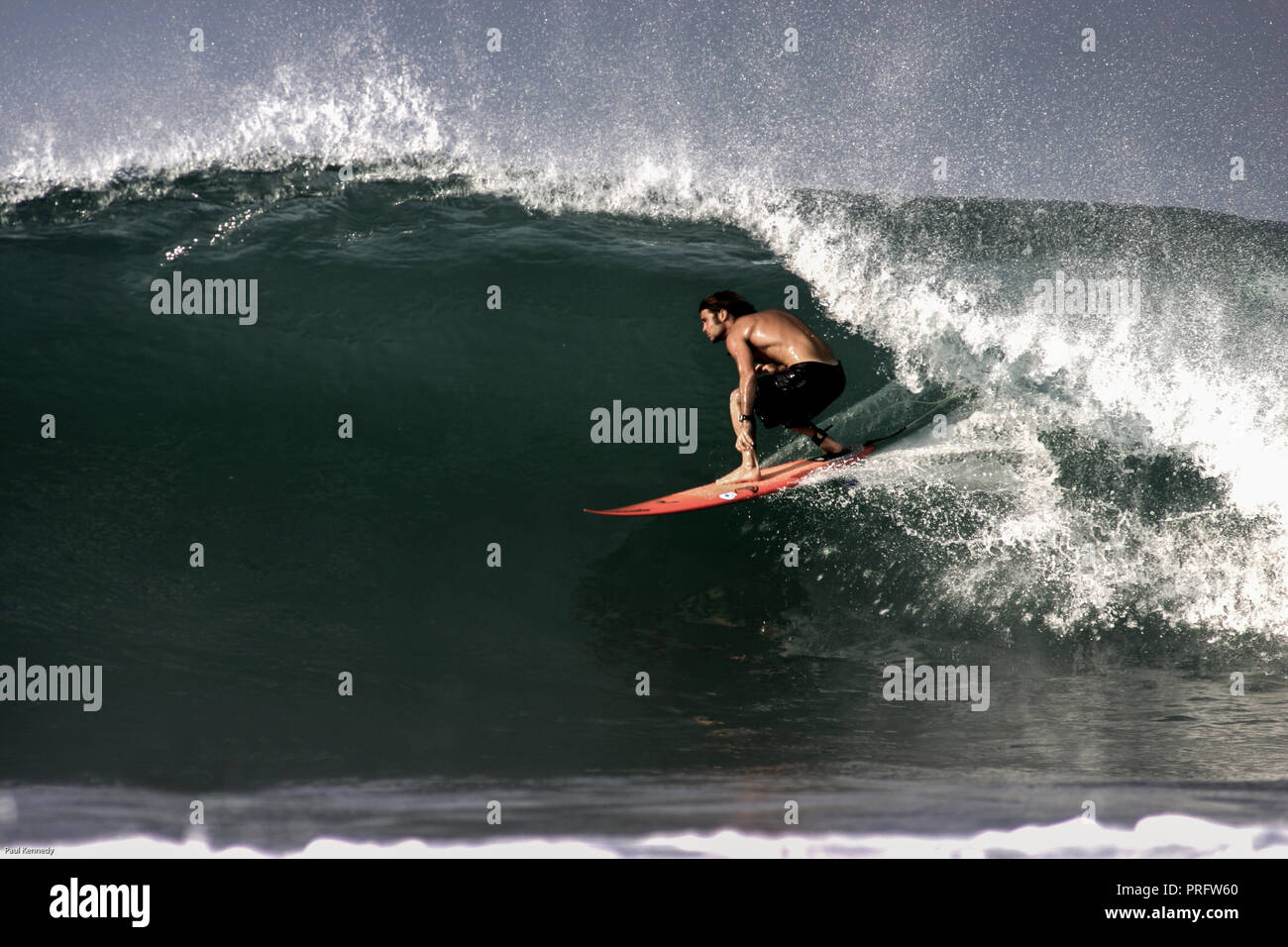 Surfer riding a surfing wave in Cimaja, West Java, Indonesia Stock ...