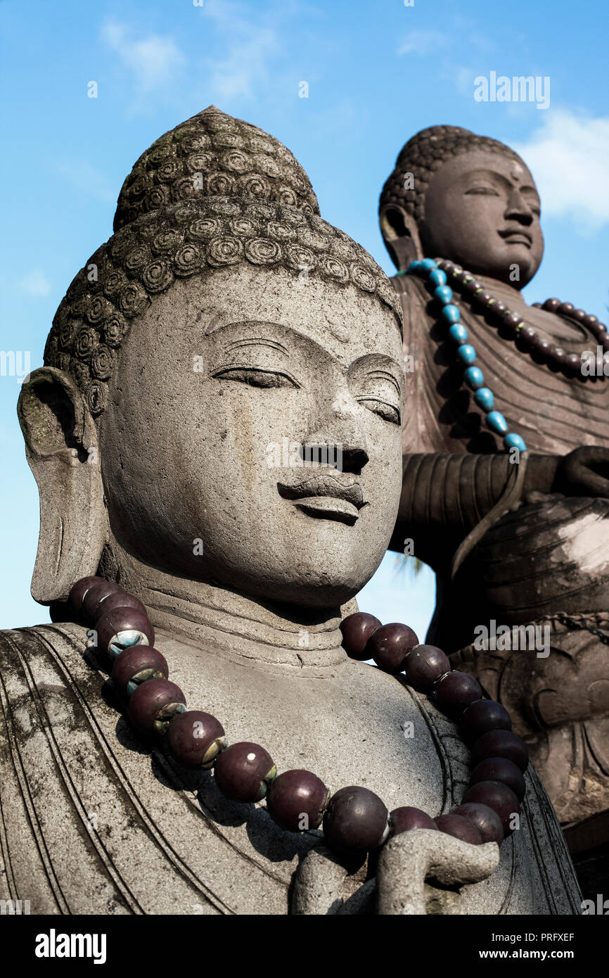 Stone Buddha statues in Bali, Indonesia Stock Photo - Alamy