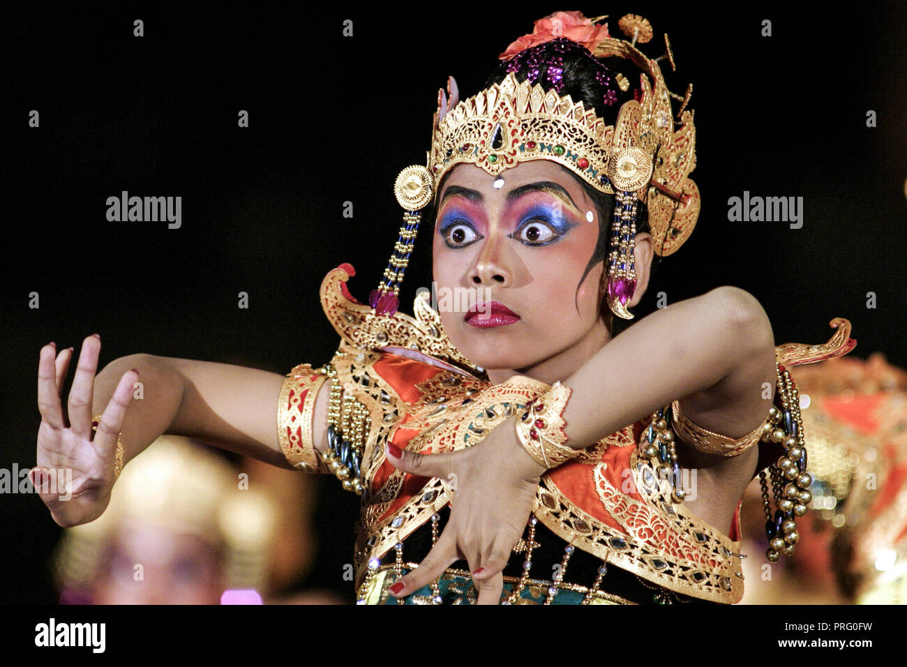 Female dancer in Balinese cultural dance performance, Denpasar ...