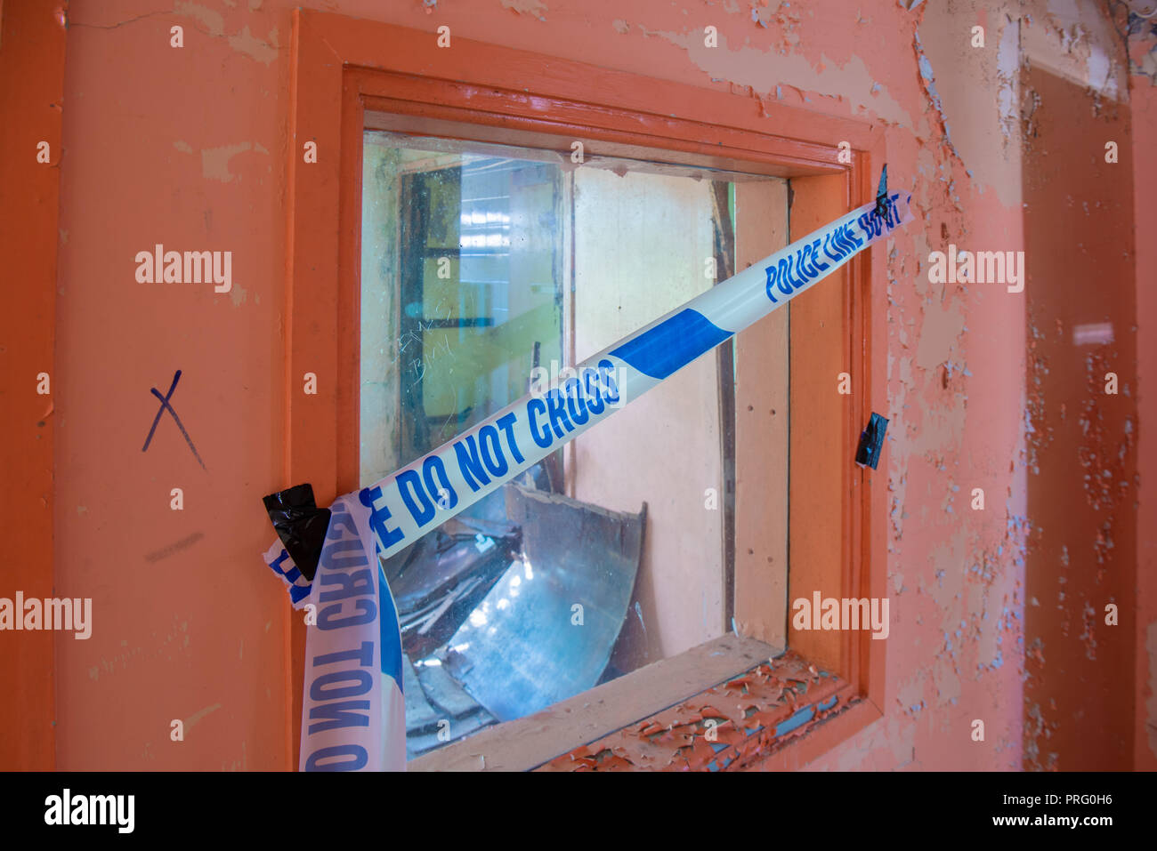 Police cordon tape across a window Stock Photo - Alamy