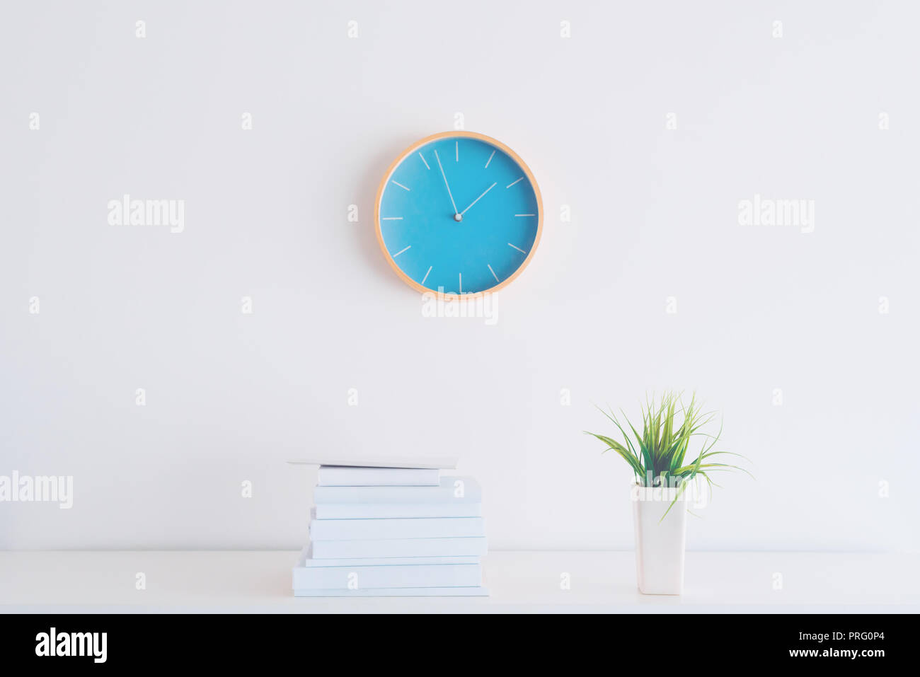 Modern bright business office interior detail depicting wall clock and ...