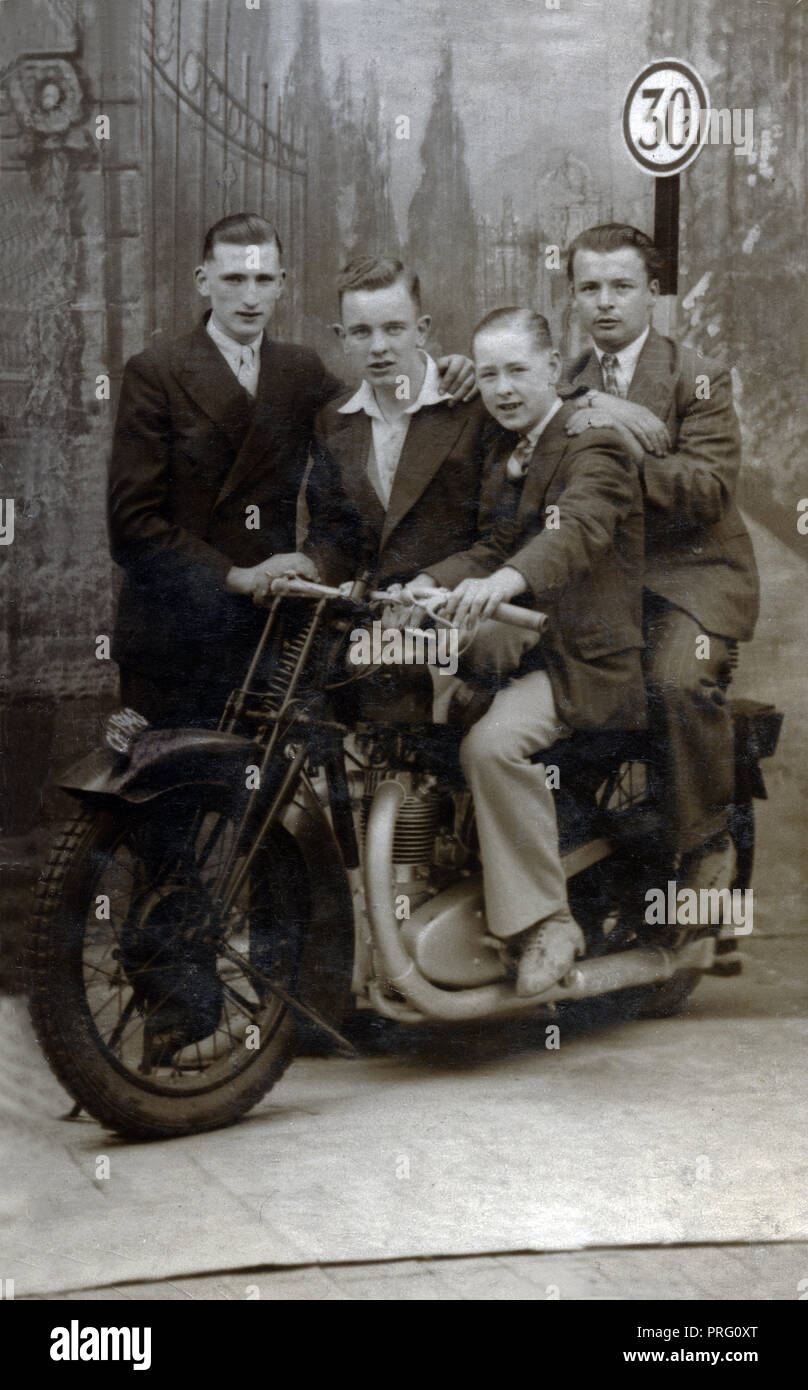 Four lads pose for a studio photograph on a 1920s Coventry Eagle 'Flying 500' JAP engined twin ...