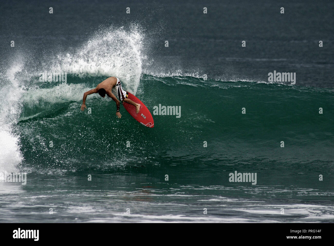 Surfer green wave at popular surfing spot Canggu in Bali, Indonesia ...