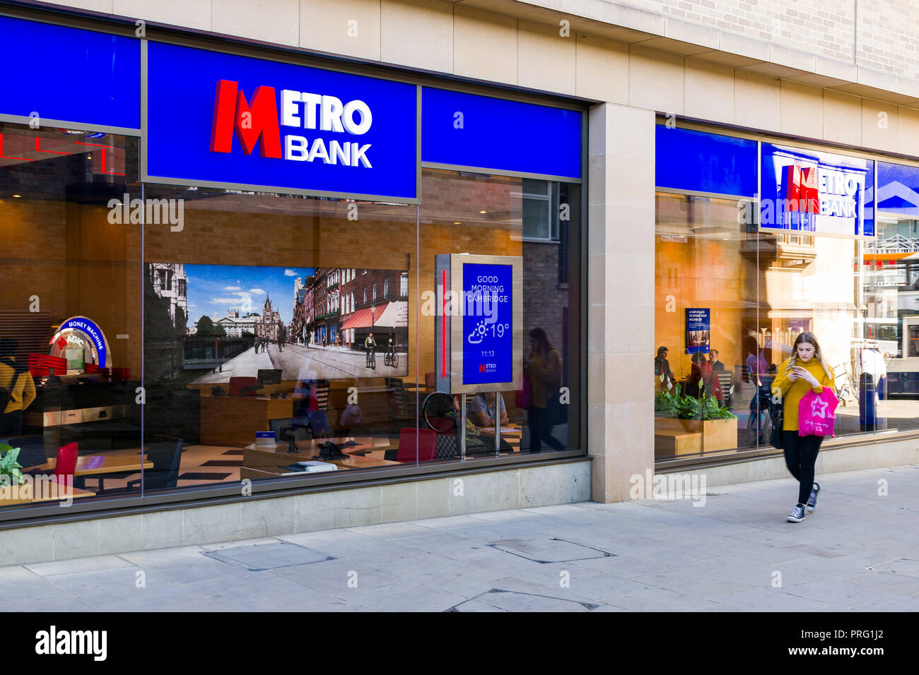 Exterior of a Metro Bank building with people walking past, Cambridge ...