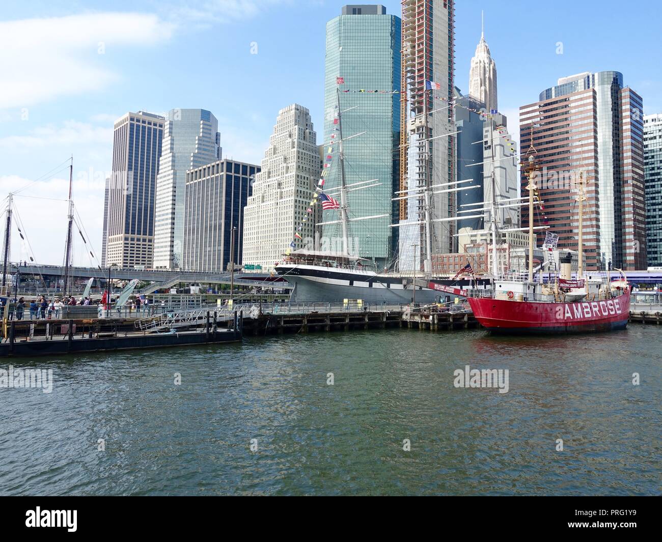 High rise buildings tower over the piers on the East River and the ...