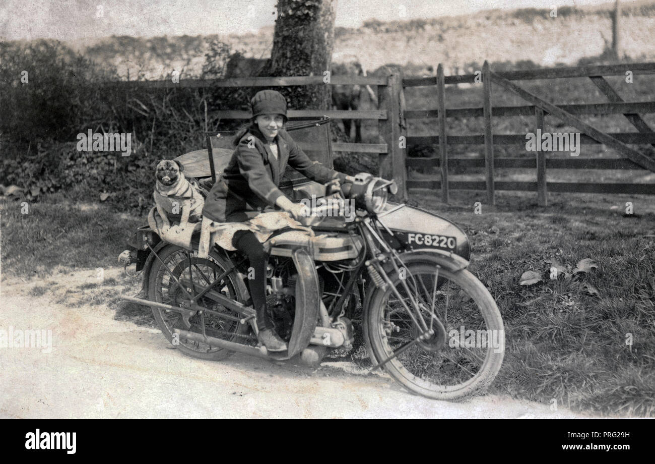 Young girl poses for photograph on a 1921 Triumph SD motorcycle ...