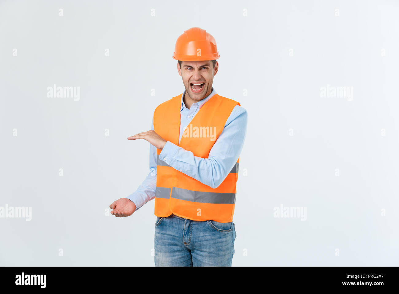 Happy beard engineer holding hand on side and explaining something, guy ...