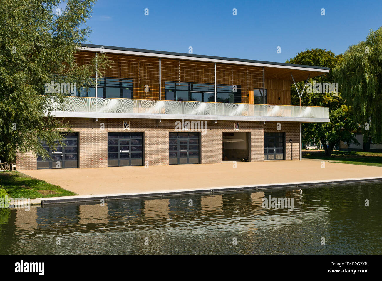 Exterior of the Selwyn College Boat Club building with the river Cam in ...