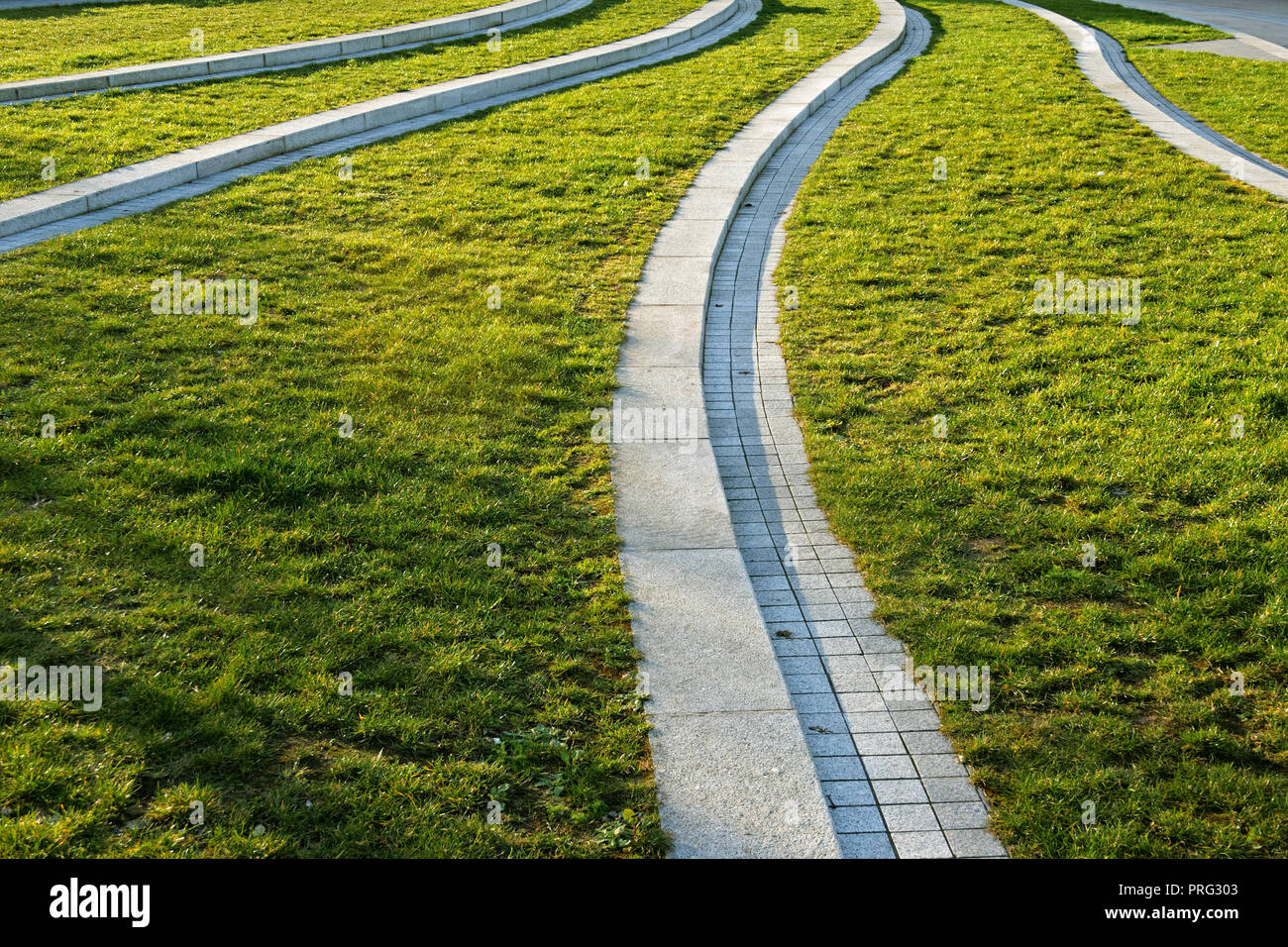 Stone tiles footpath green grass hi-res stock photography and images ...