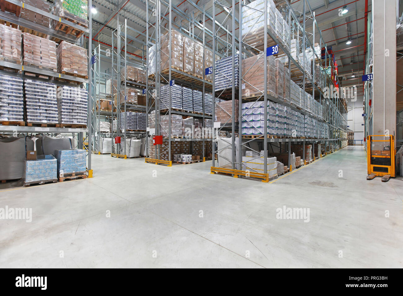 Shelves with goods in distribution center warehouse Stock Photo - Alamy