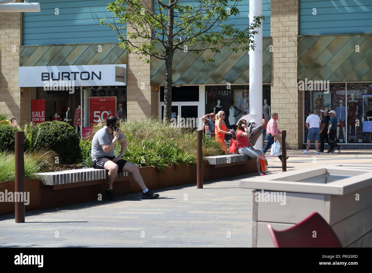 Shop signs at Glasgow Fort Shopping Centre Stock Photo - Alamy