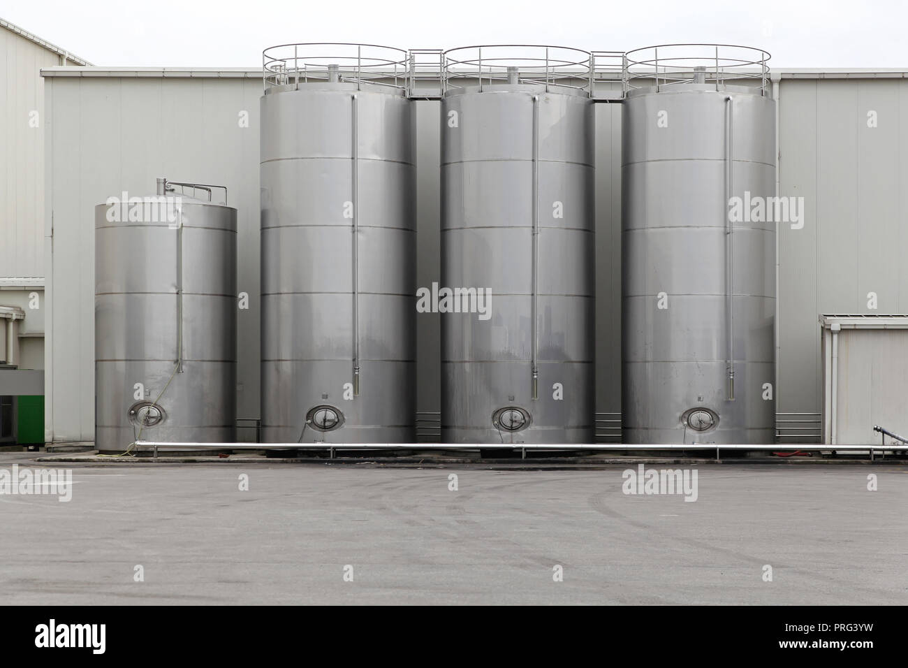 Stainless steel silo for storing bulk materials in factory Stock Photo ...