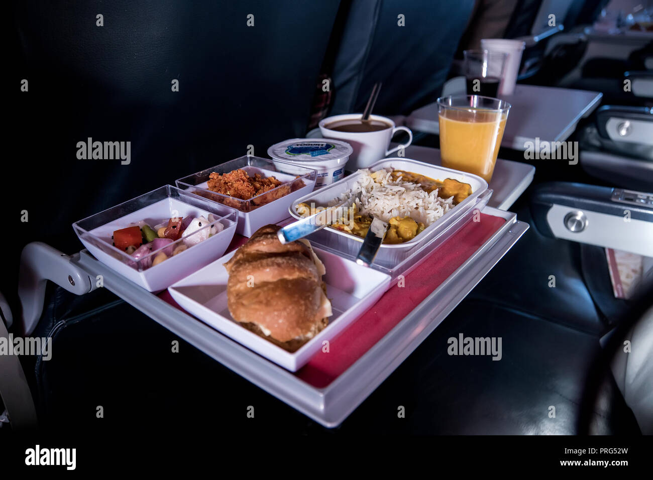 Tray of food. The passenger eats food on Board the plane on the ...