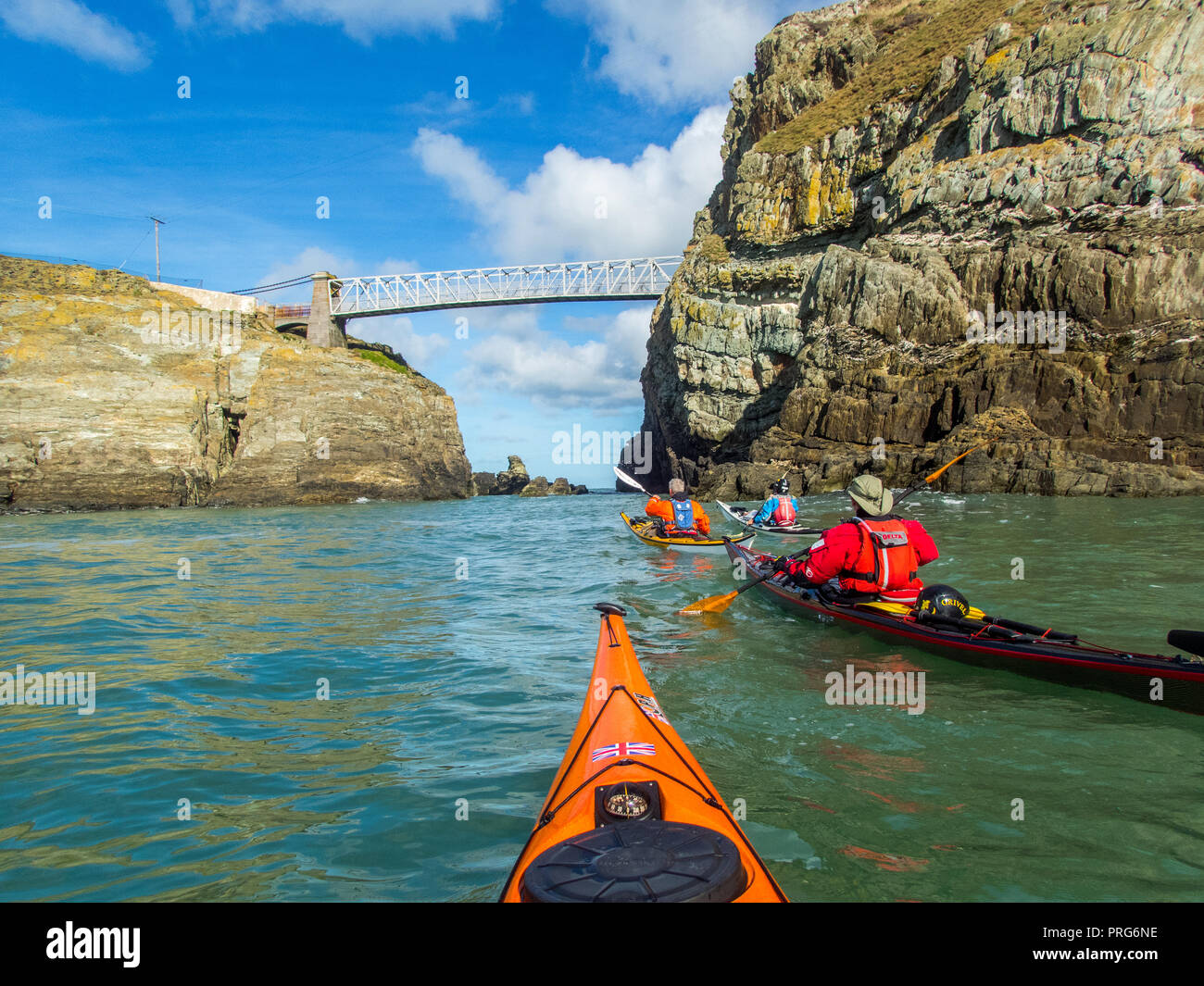 Sea kayaking towards South Stack on Holy Island, Anglesey, North Wales ...