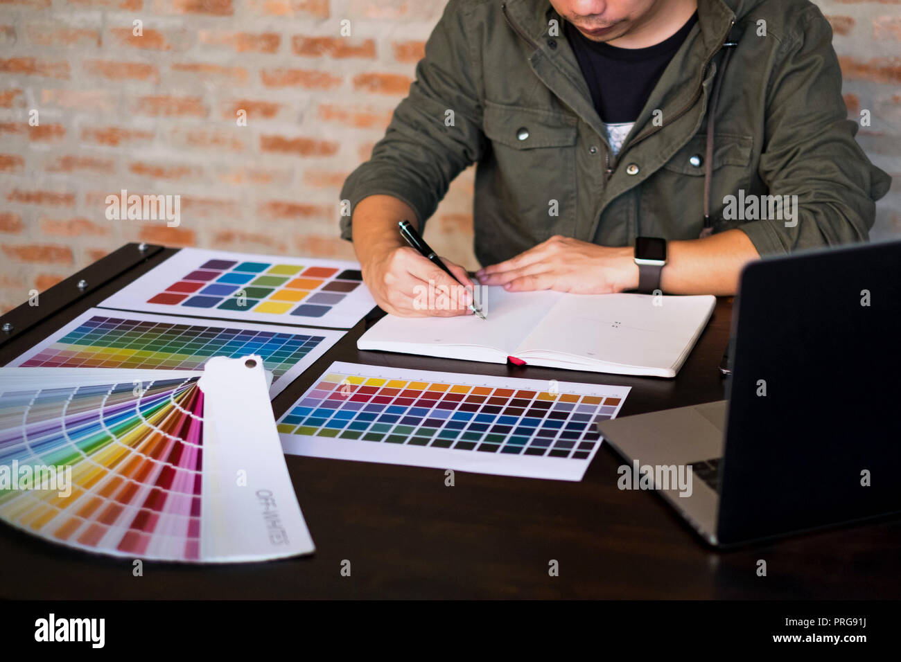 Graphic designers choose colors from the color bands samples for design ...