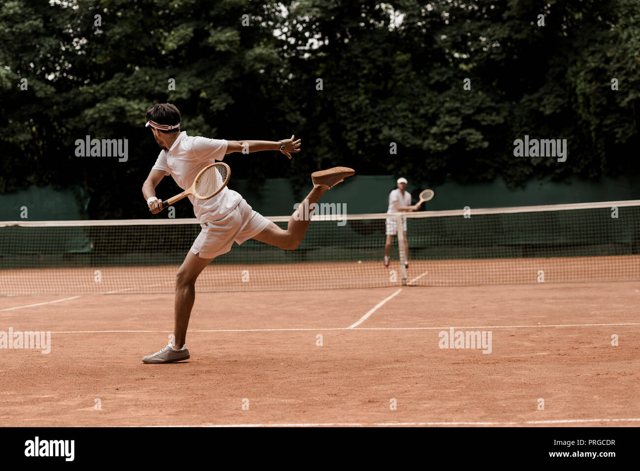 Men playing tennis hi-res stock photography and images - Alamy