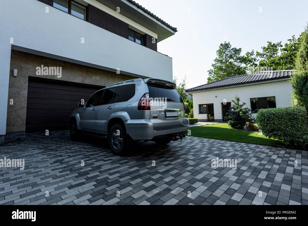 facade of new modern building with car on parking Stock Photo - Alamy