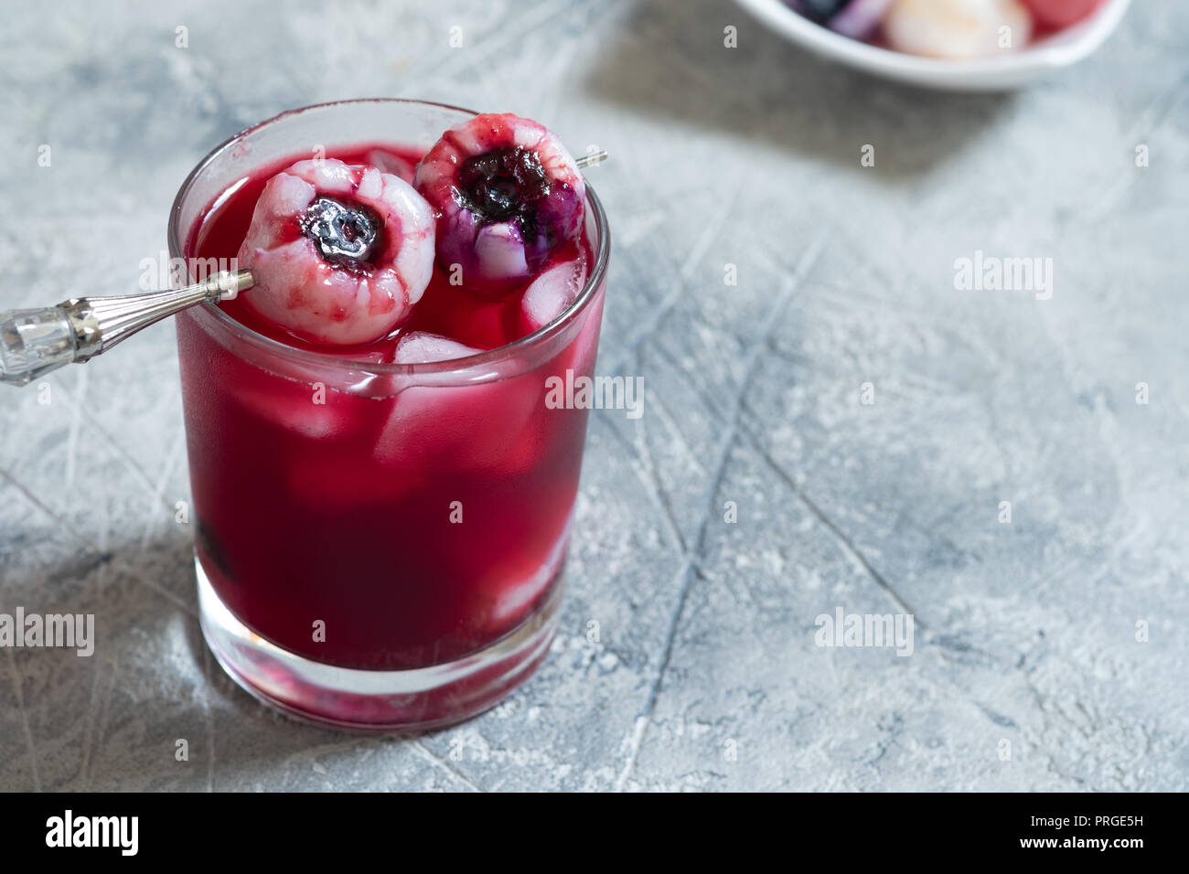 Red halloween cocktail with eye Stock Photo - Alamy