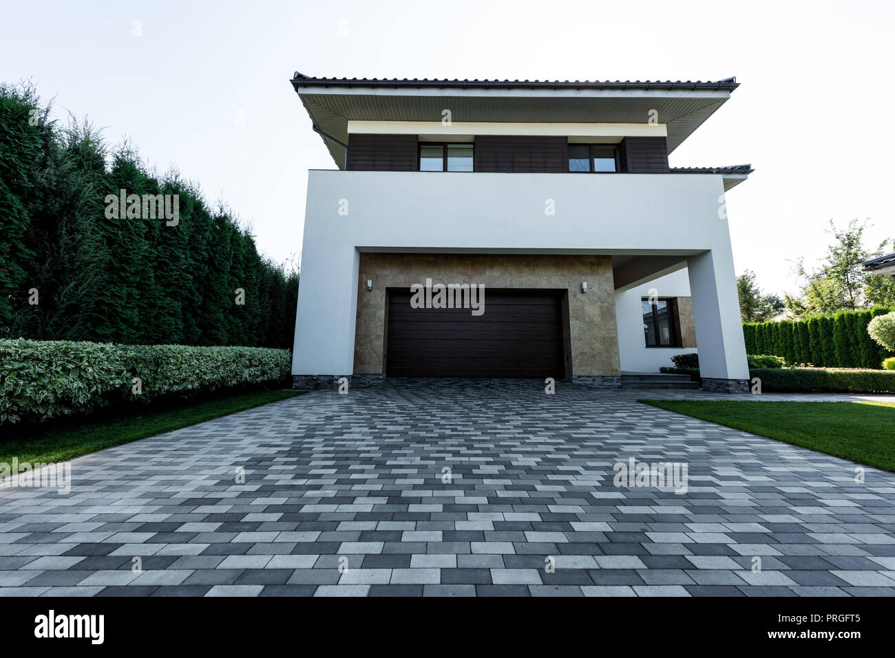 exterior of new modern house with empty parking Stock Photo - Alamy