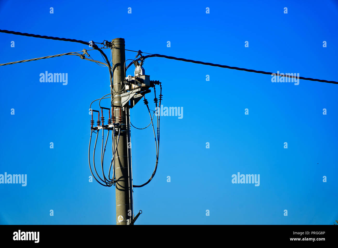 High voltage post with wire. High-voltage tower and sky on background ...
