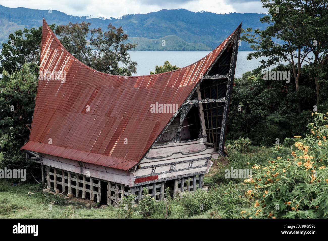 Peak roofed Batak house on Samosir Island, Lake Toba, Sumatra ...