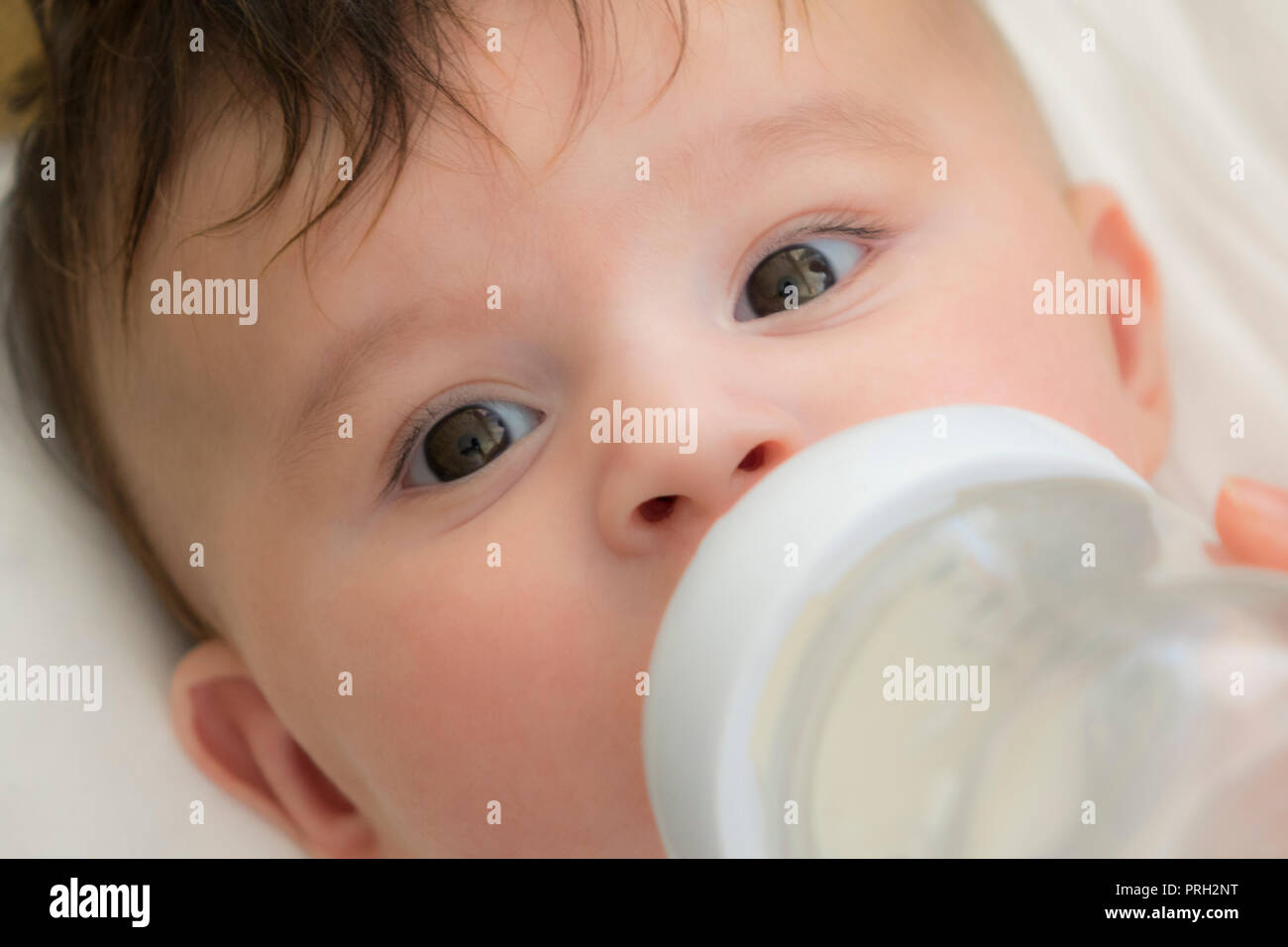 Baby boy being bottle fed hi-res stock photography and images - Alamy