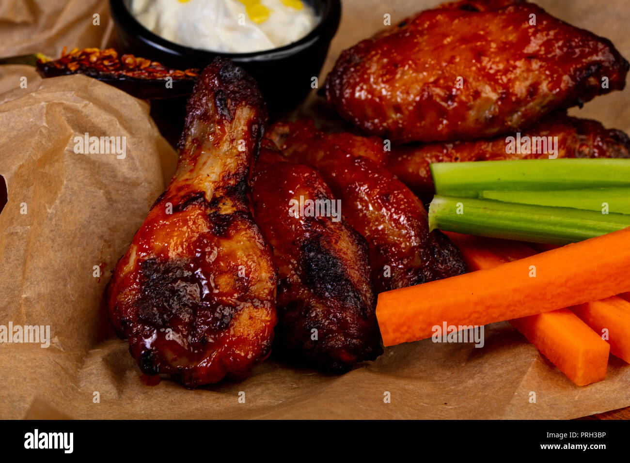 Roasted chicken wings with parsley sticks Stock Photo - Alamy