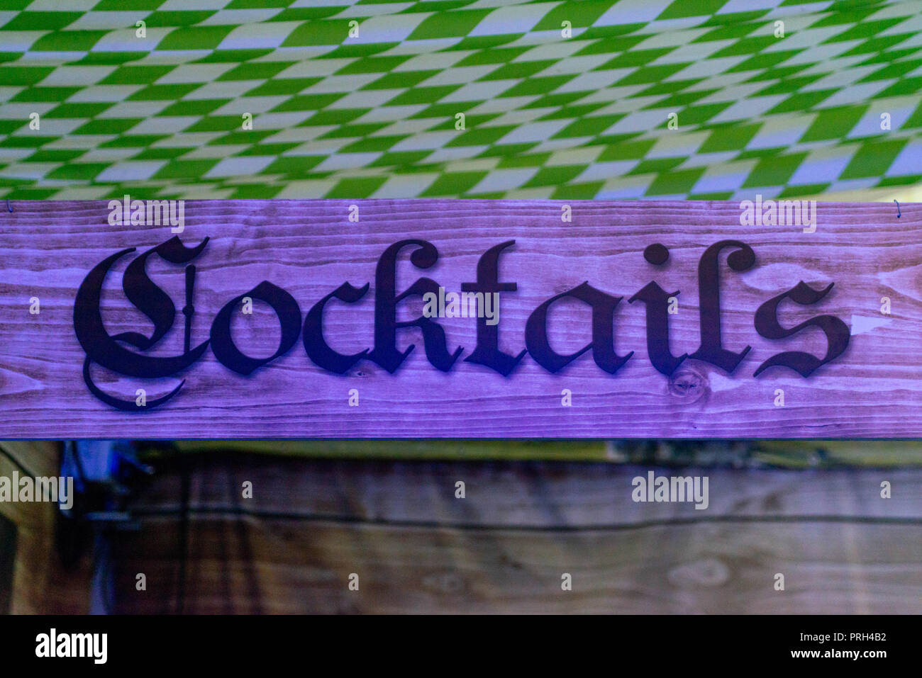 wooden signs from a bar at the german oktoberfest referring to ...