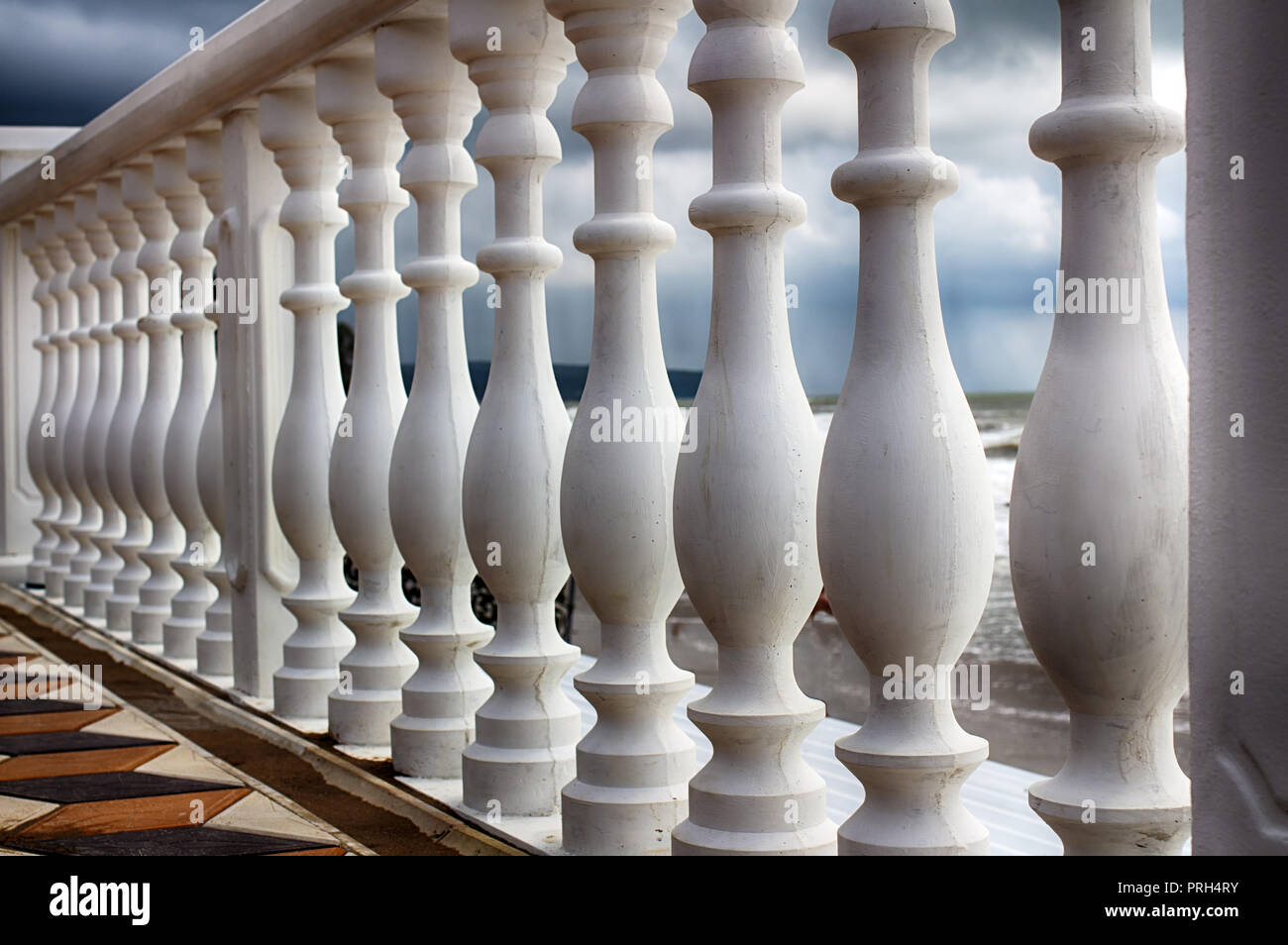 A row of white concrete balusters on the waterfront close-up Stock ...