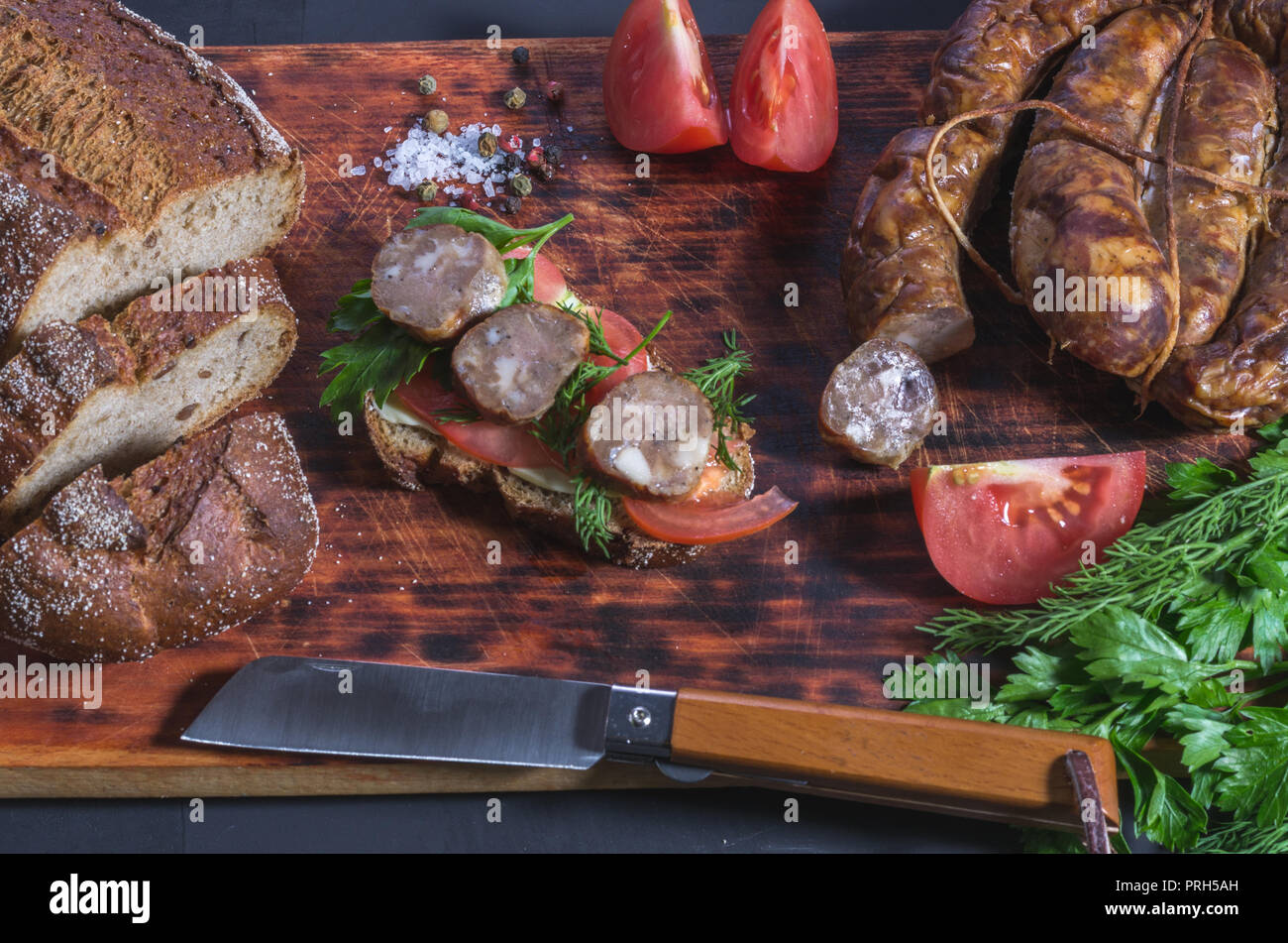 Cutting foods with a sharp knife for sandwiches. Top view at an angle ...