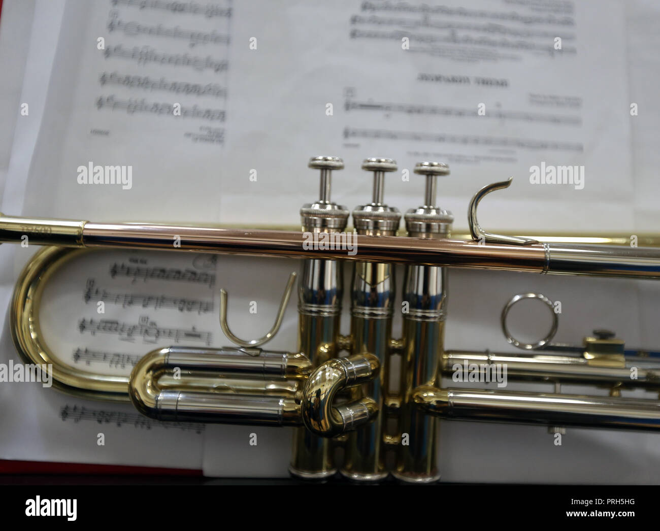 A trumpet with sheet music on a music stand in a school orchestra Stock ...