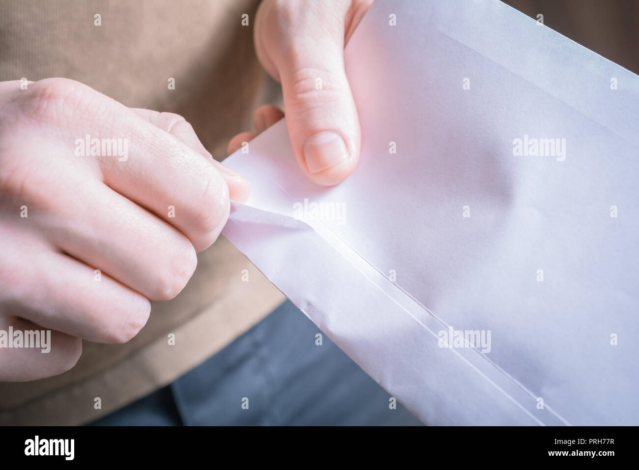 Male Hands Opening The Edge Of An Envelope - Waiting For A Message ...