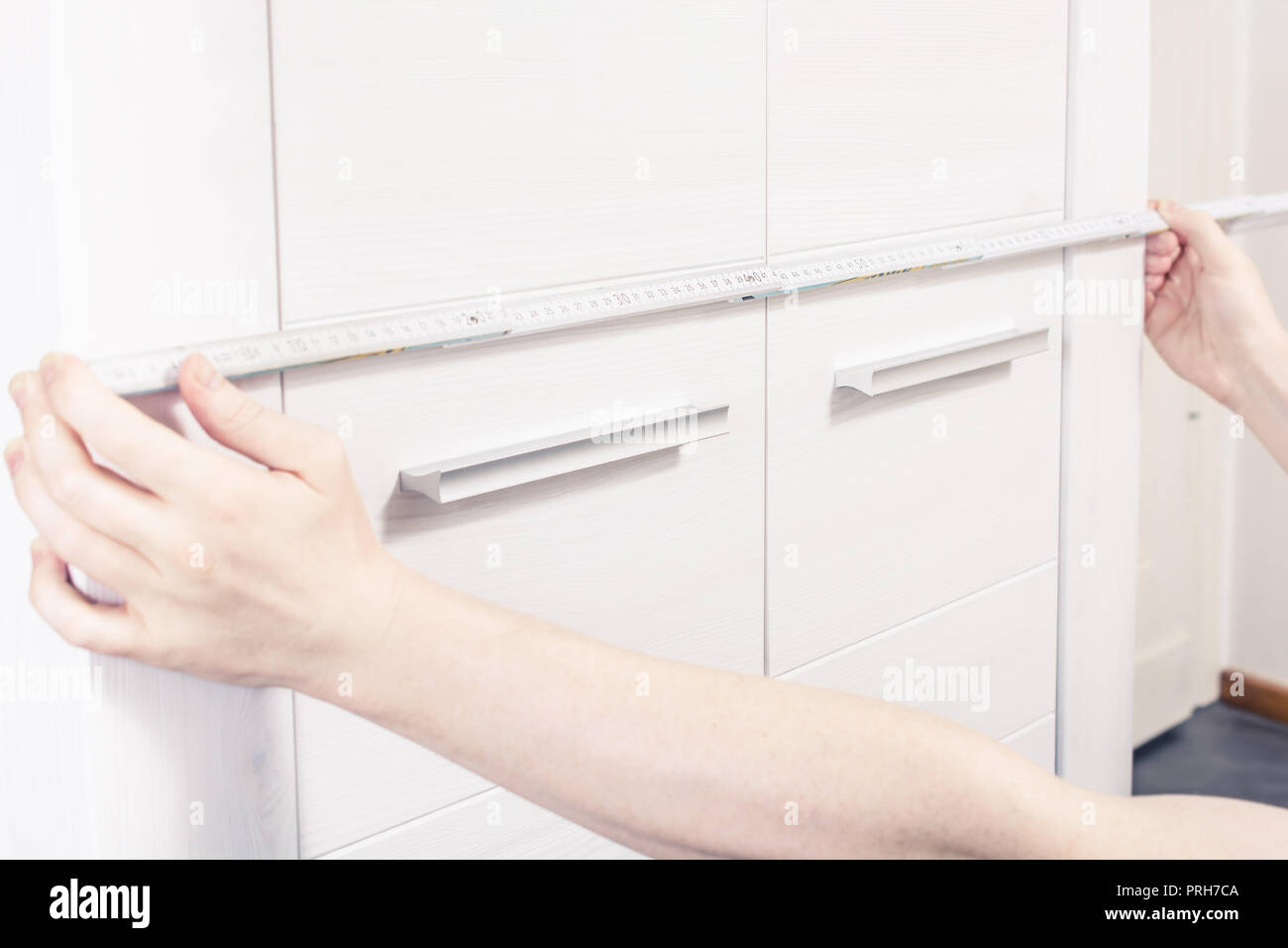 Measuring The Door Size Of A Wardrobe With A Solid Folding Ruler Stock ...