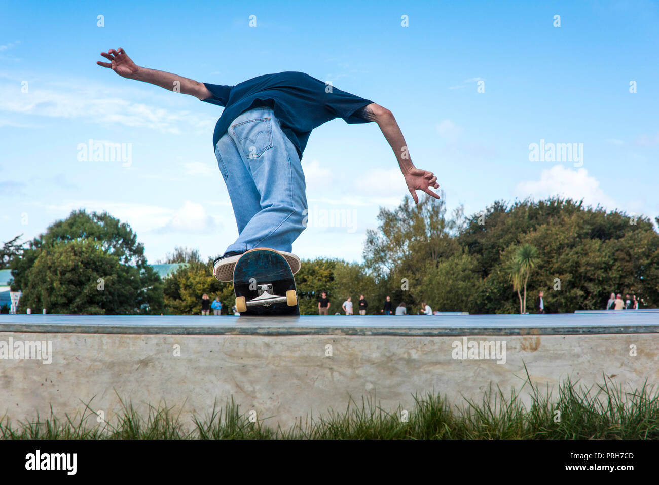 A skateboarder launching from a deck at Concrete Waves Skateboard Park ...