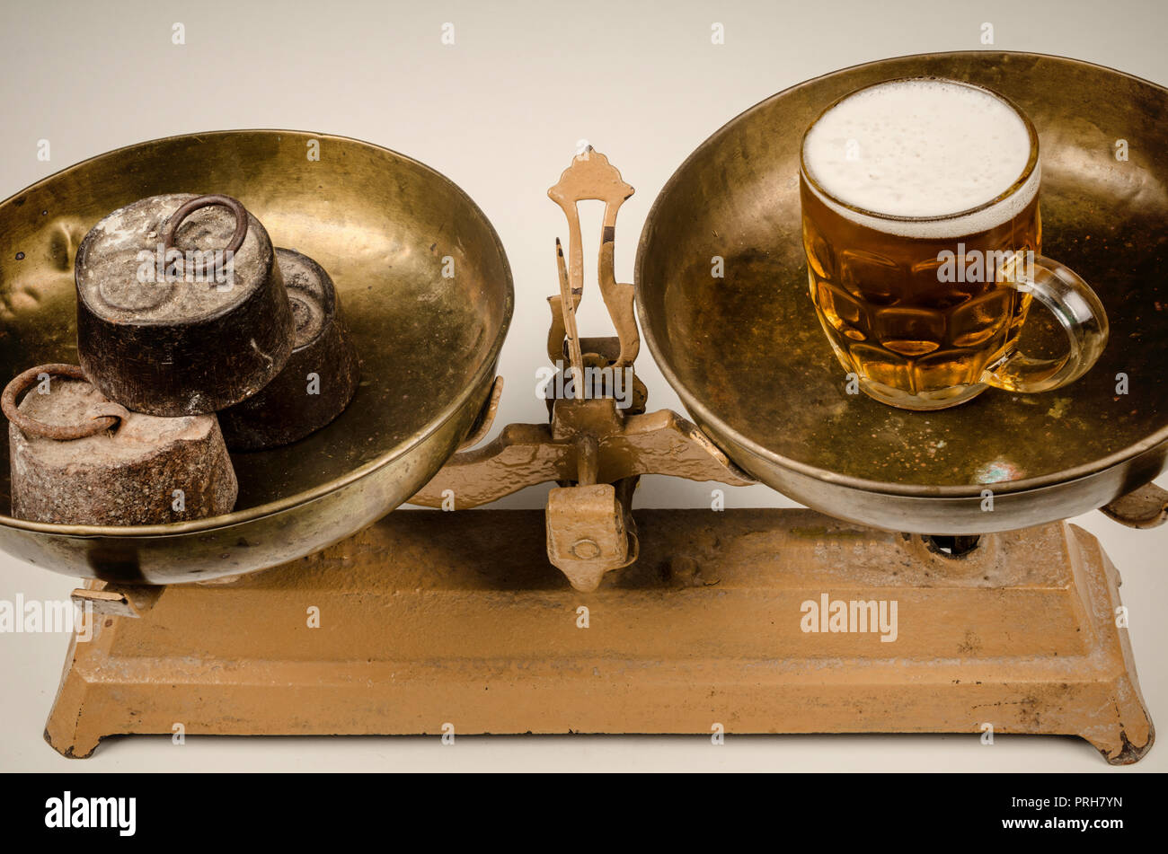Beer and water on vintage scales, an alcoholism concept Stock Photo - Alamy