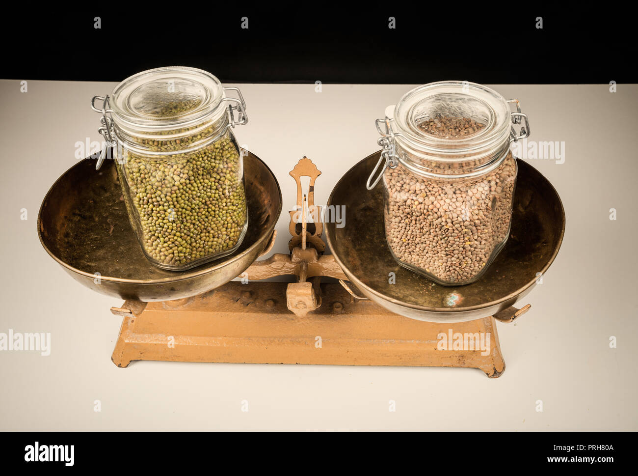 Jars with legumes on vintage scales, a healthy eating concept Stock ...