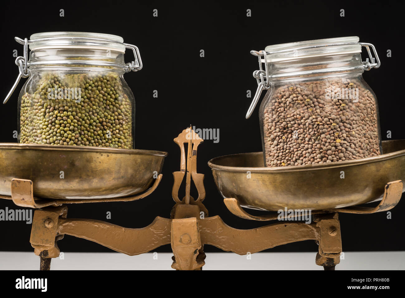 Jars with legumes on vintage scales, a healthy eating concept Stock ...