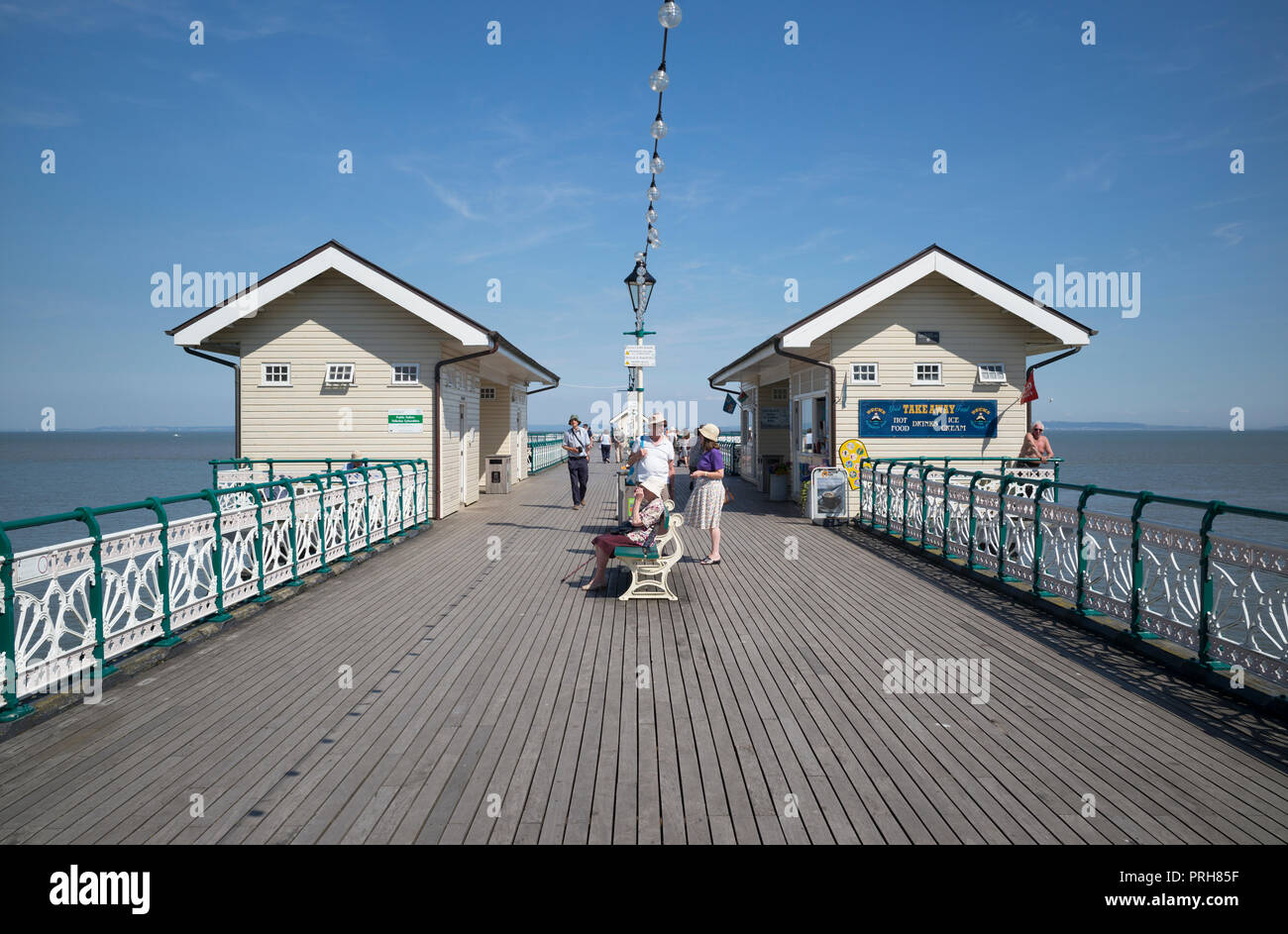Deck of Penarth pier, south Wales, with wooden boards and cast iron ...