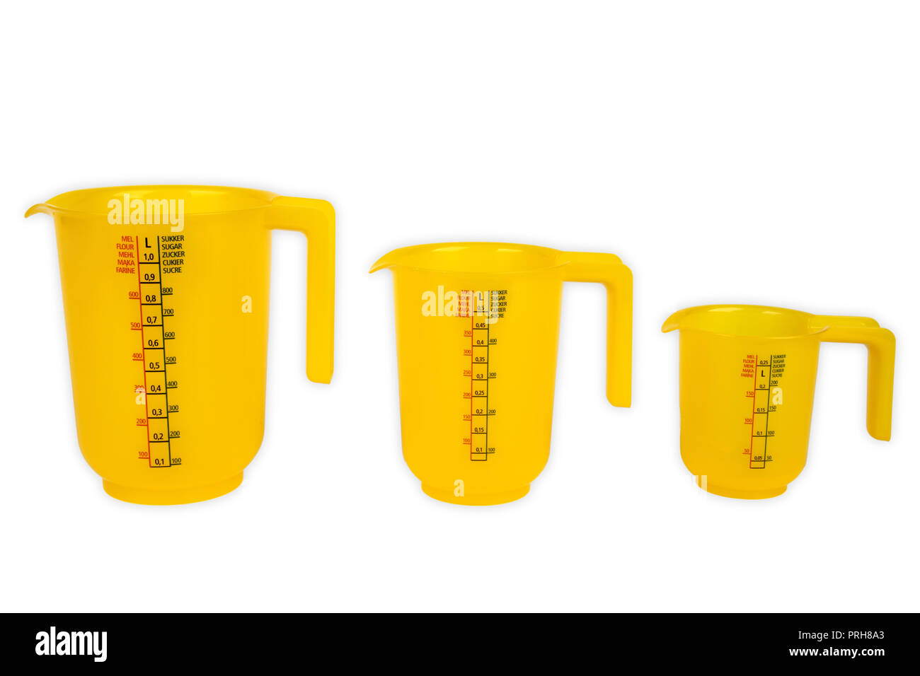Yellow Measuring Cups isolated on white background Stock Photo - Alamy