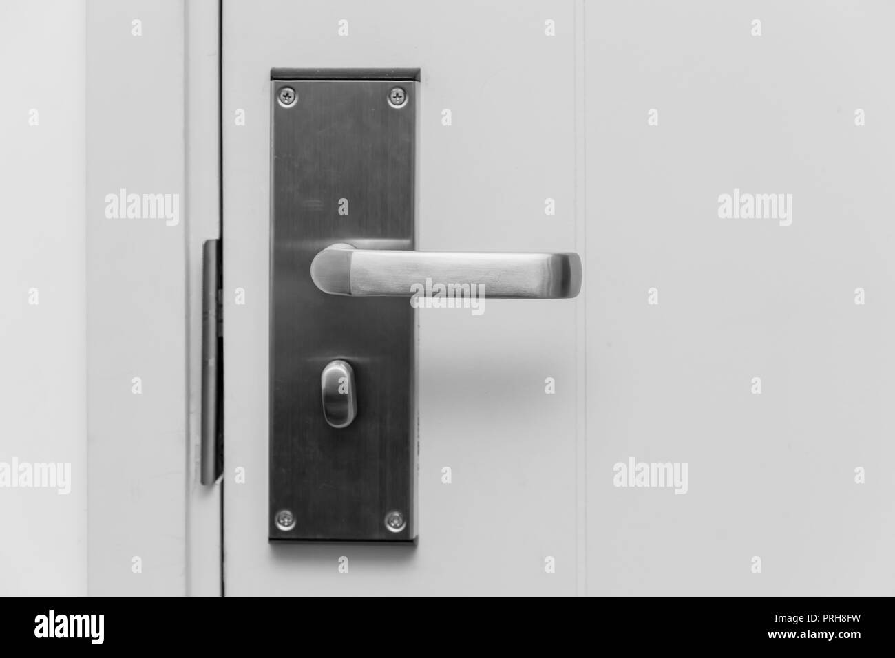 Home door stainless steel handle lever lock solid strong Stock Photo ...