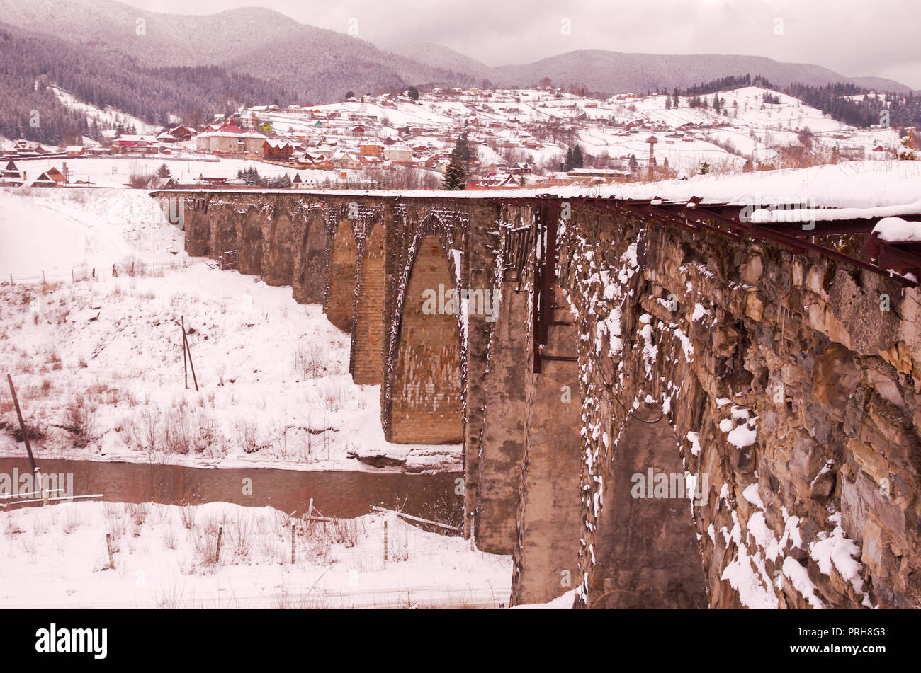 Old railway bridge. Old arch bridge. Winter Stock Photo - Alamy