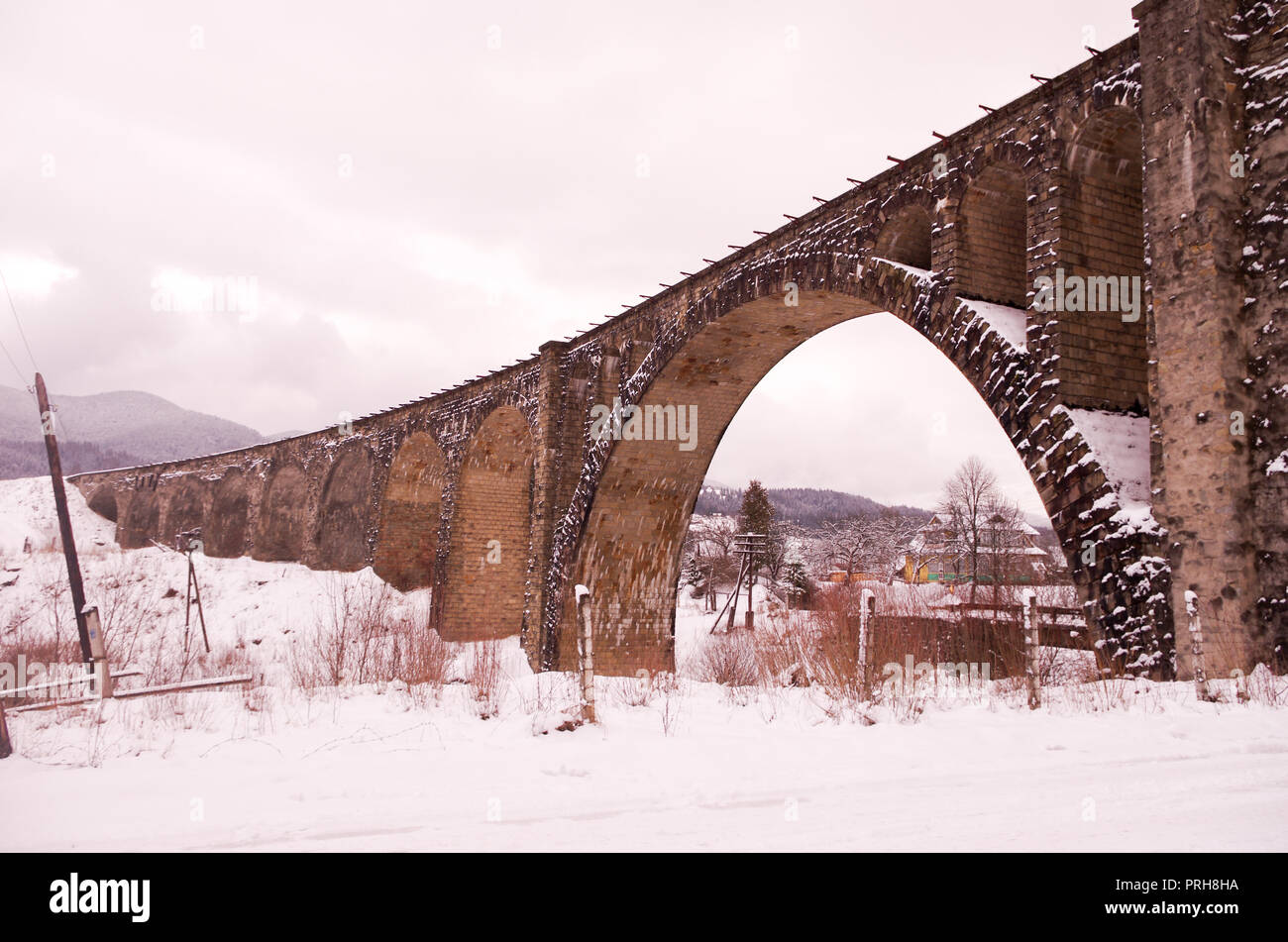 Large arch of a brick bridge. Old prewar bridge. Winter Stock Photo - Alamy