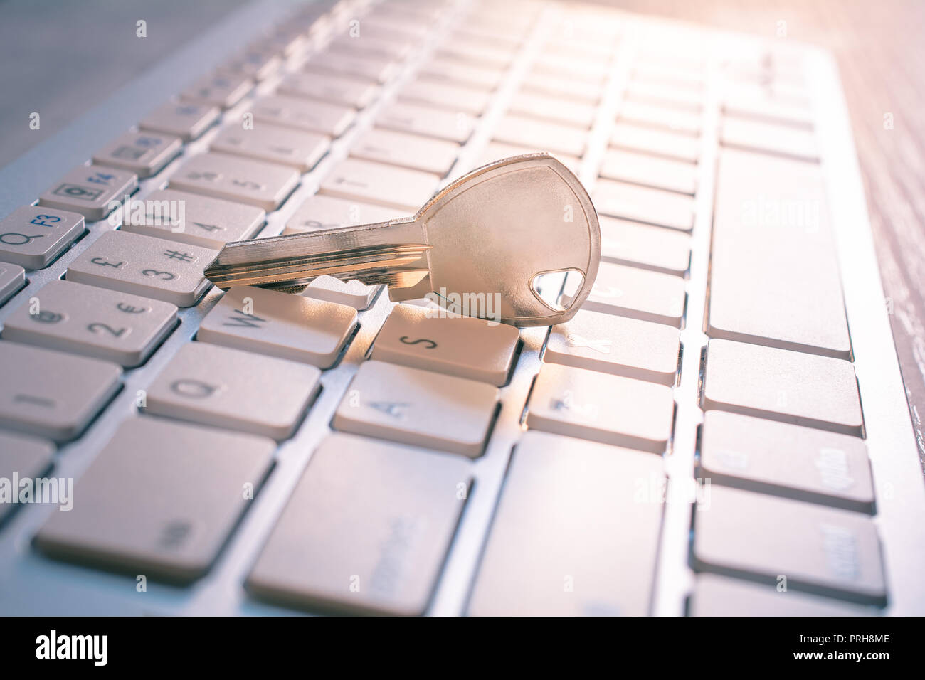 Metal Key On A White Keyboard - Secure Computer Login Concept Stock ...