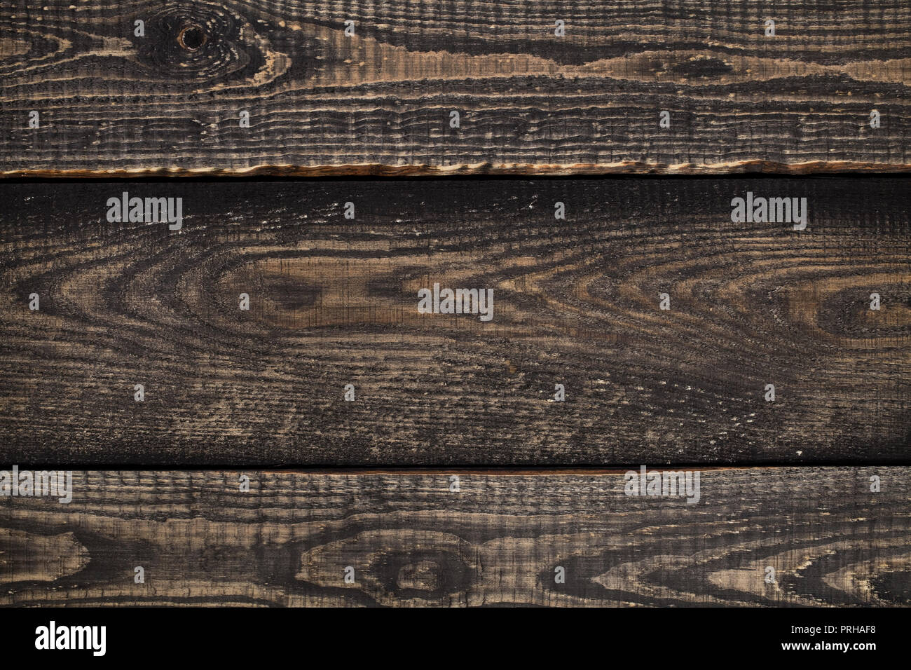 Close up of dark rustic wall made of old wood table planks texture ...