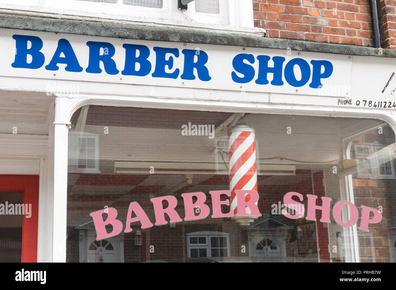 Barber's shop with its traditional red and white symbol in Marlow ...