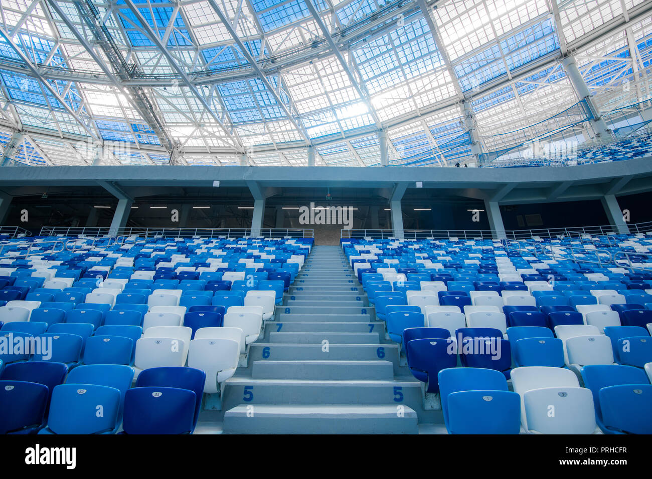 Cement stairs and blue seats inside football stadium Stock Photo - Alamy