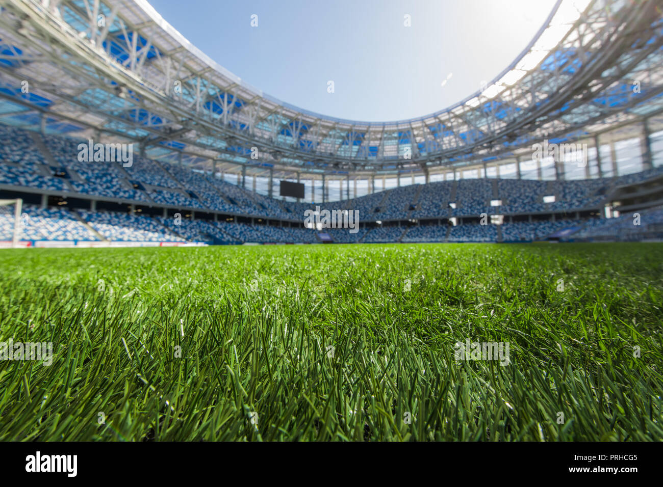 Sport grass field stadium on a sunny day blue sky Stock Photo - Alamy