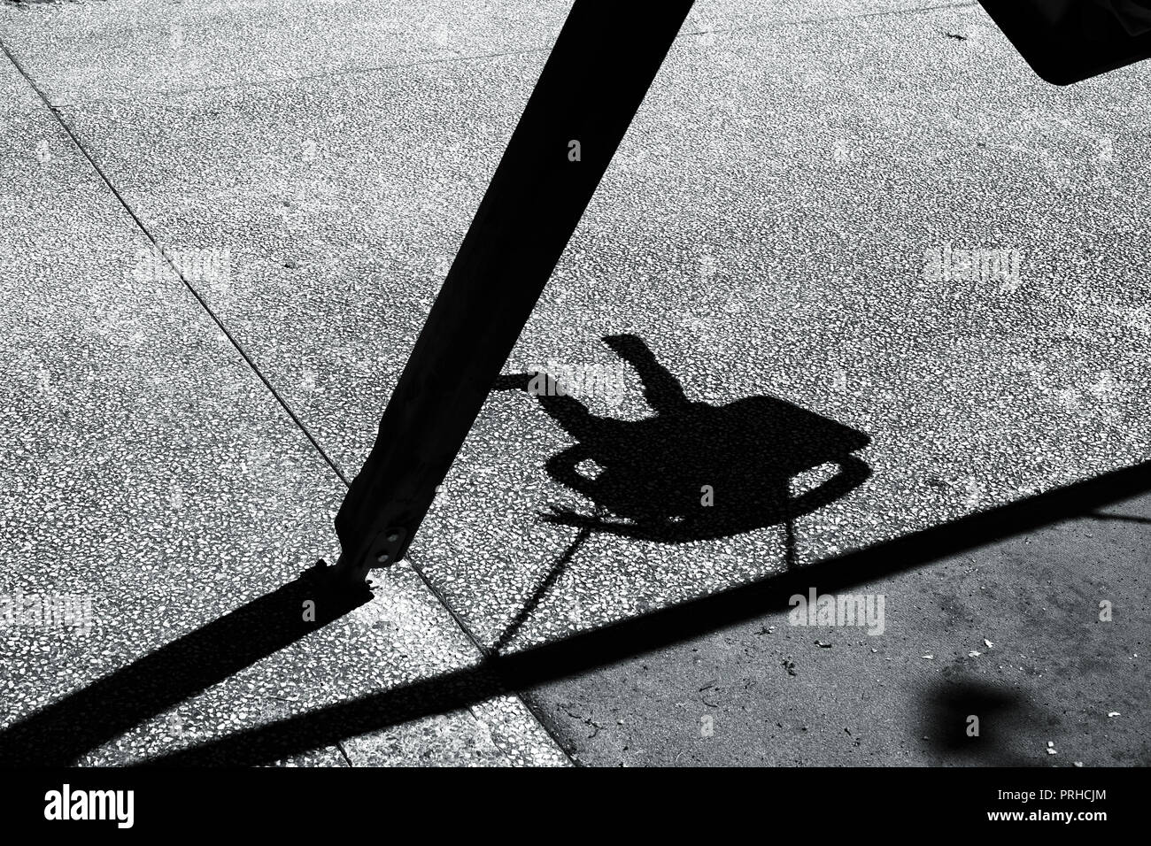 A shadow of a child on a swing Stock Photo - Alamy