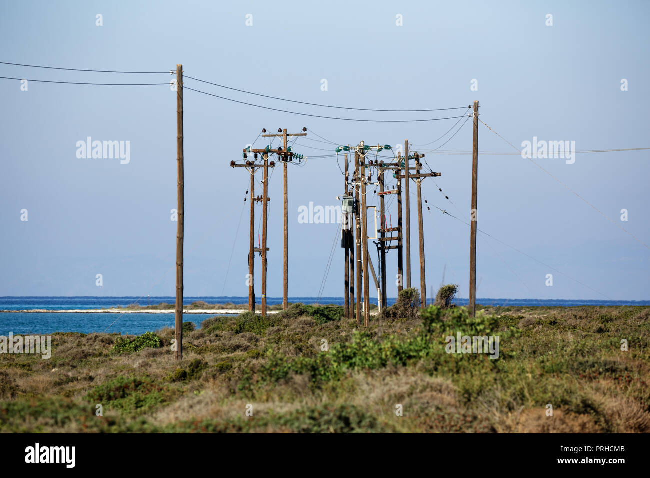 Medium voltage power lines in a rural area near sea Stock Photo - Alamy
